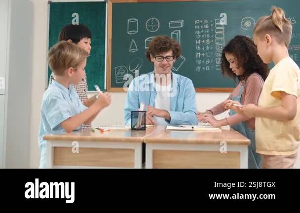 Smart teacher explain idea while diverse children drawing mind map ...