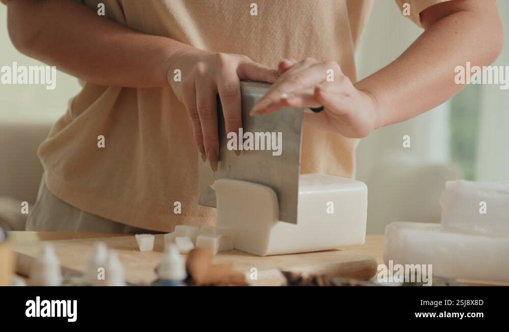 Young Woman Slicing Premade Soap Base Stock Video Footage - Alamy