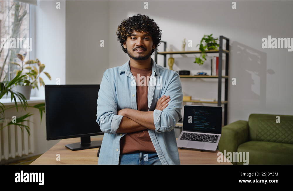 Positive software engineer looks straight smiling dreamy Stock Video ...