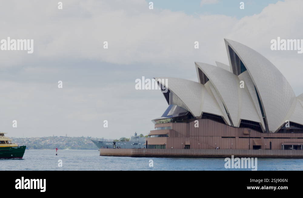 The large Manly ferry passes by the opera house in Sydney, Australia ...