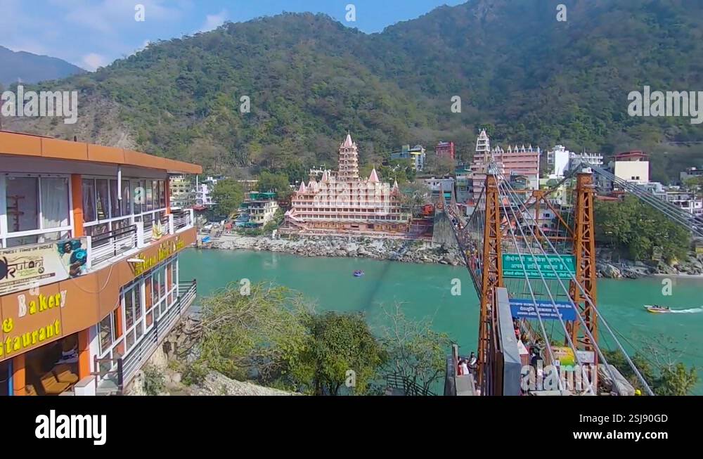 hindu temple at ganges river shore with mountain background at day from ...