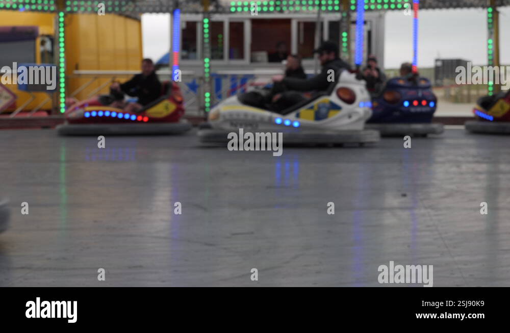 Slow and fast shots of people riding the dodgem cars Stock Video ...
