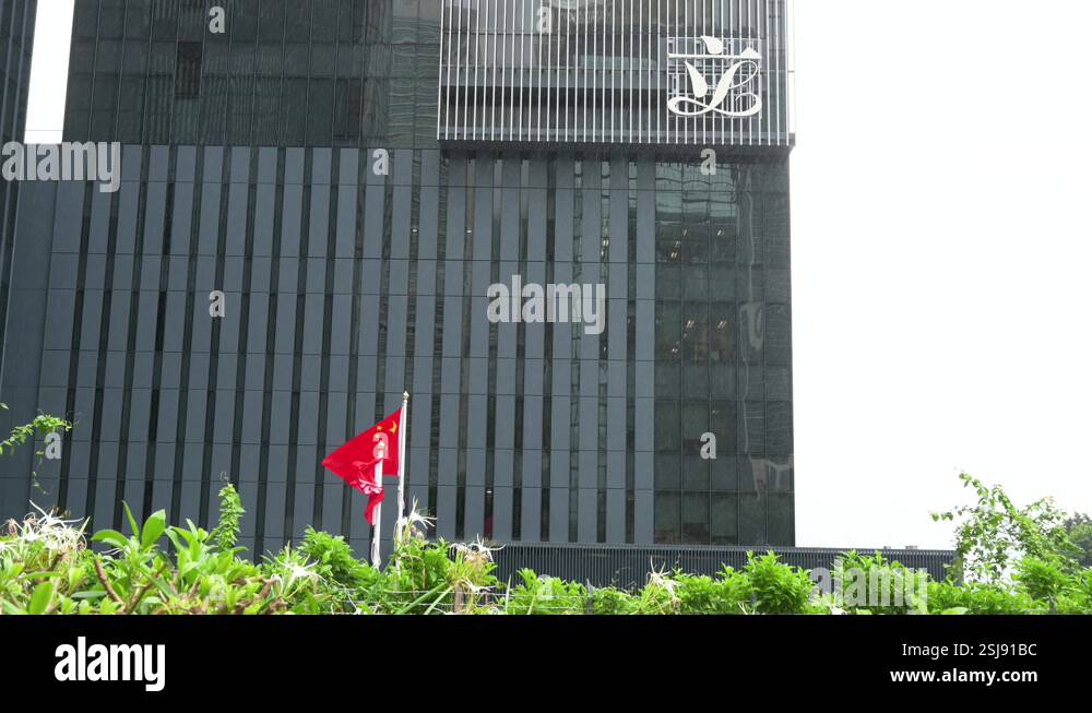 The People's Republic of China and the Hong Kong SAR flags wave on a ...