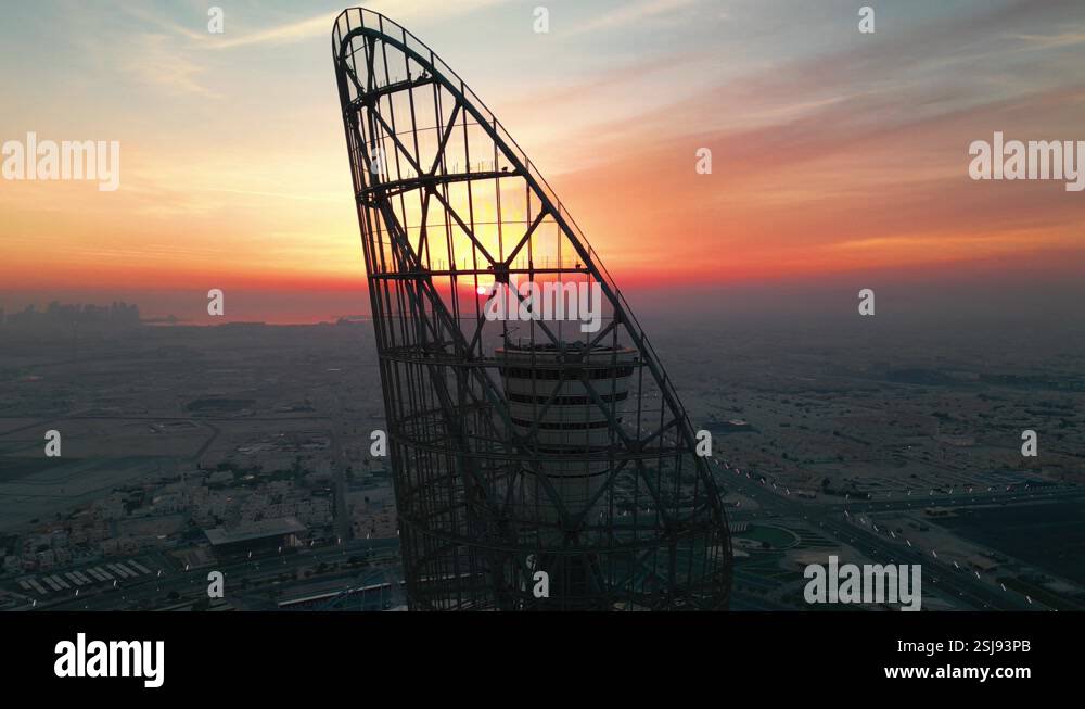 Sunrise aerial of Torch Tower and Khalifa Stadium in Doha, Qatar. Drone ...