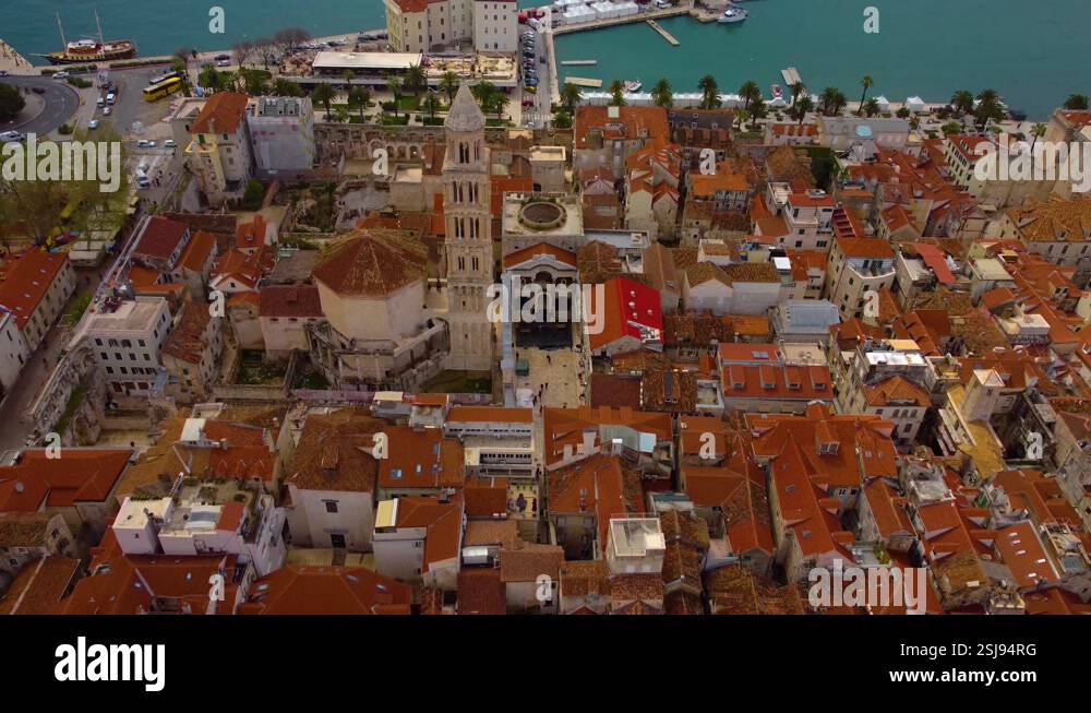 4K reverse tracking shot with gradual upward tilt over the Old Town of ...