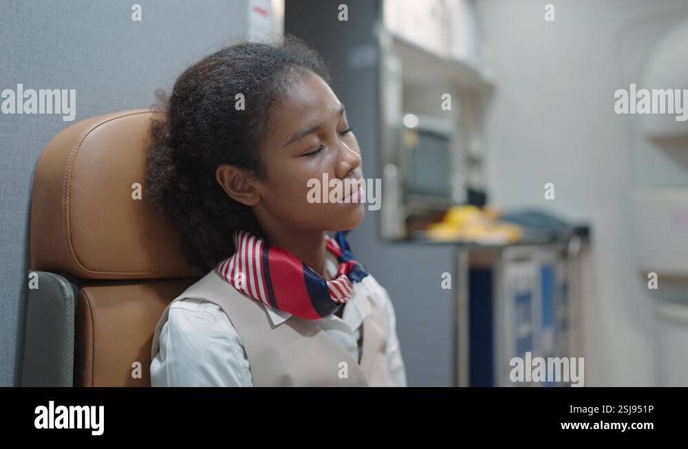 Woman flight attendant looking tired after a long international flight ...