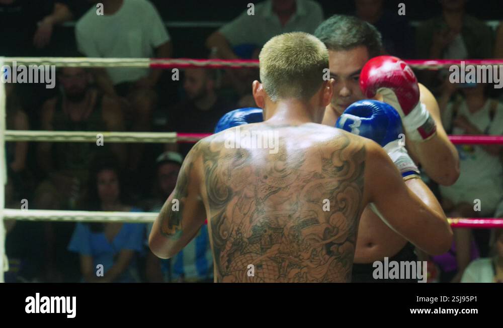 4K Cinematic slow motion footage of two Asian fighters fighting on a ...