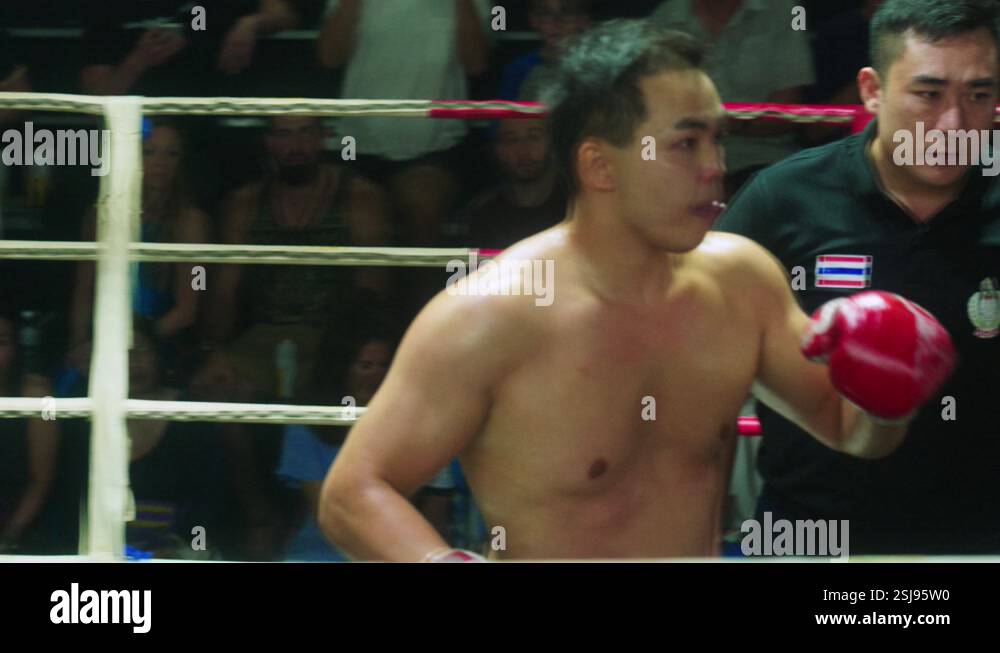 4K Cinematic slow motion footage of two Asian fighters fighting on a ...