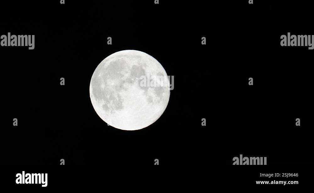 Cloud blowing past a full moon over Ambleside, Lake District, UK Stock ...