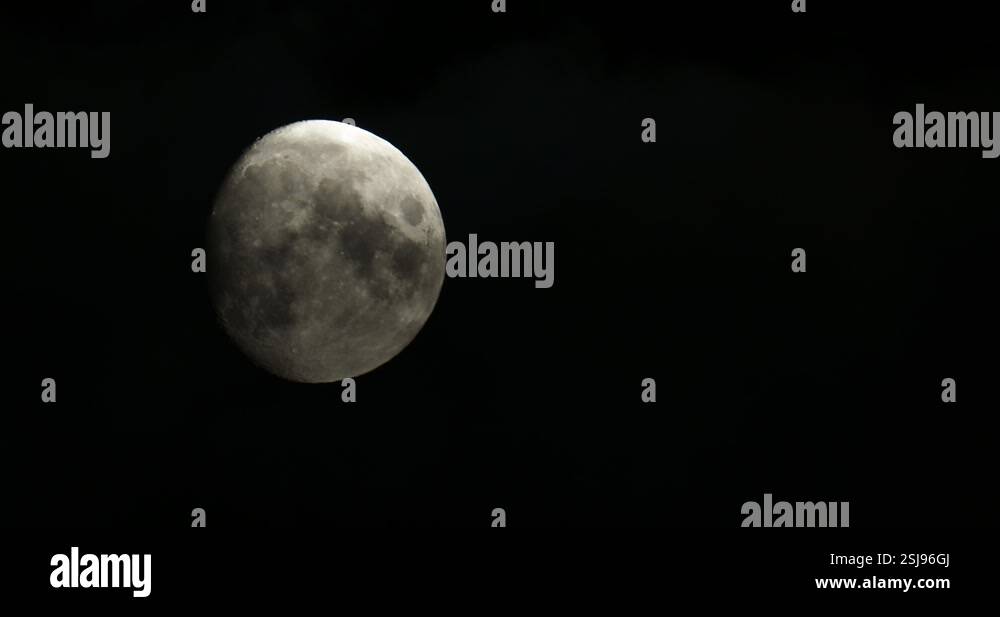 Clouds blowing ifront of an almost full moon over Ambleside, Lake ...