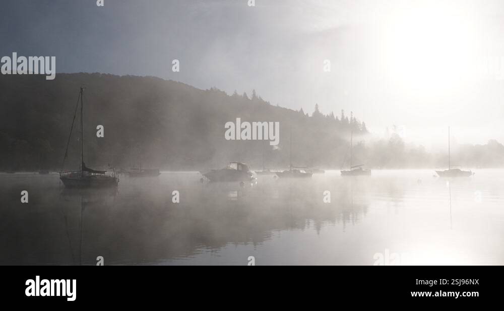 Autumn mist on Lake Windermere, Ambleside, Lake District, UK with ...