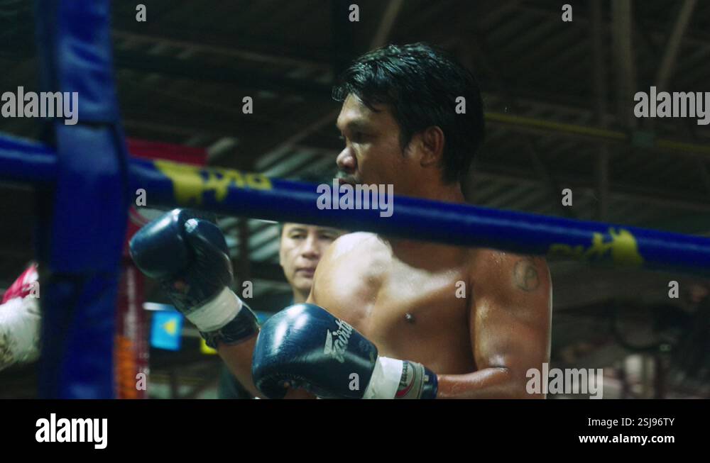 4K Cinematic slow motion footage of two Thai fighters fighting on a ...