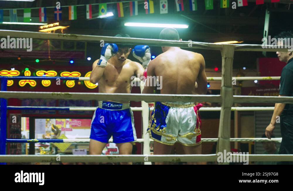4K Cinematic slow motion footage of two Thai fighters fighting on a ...