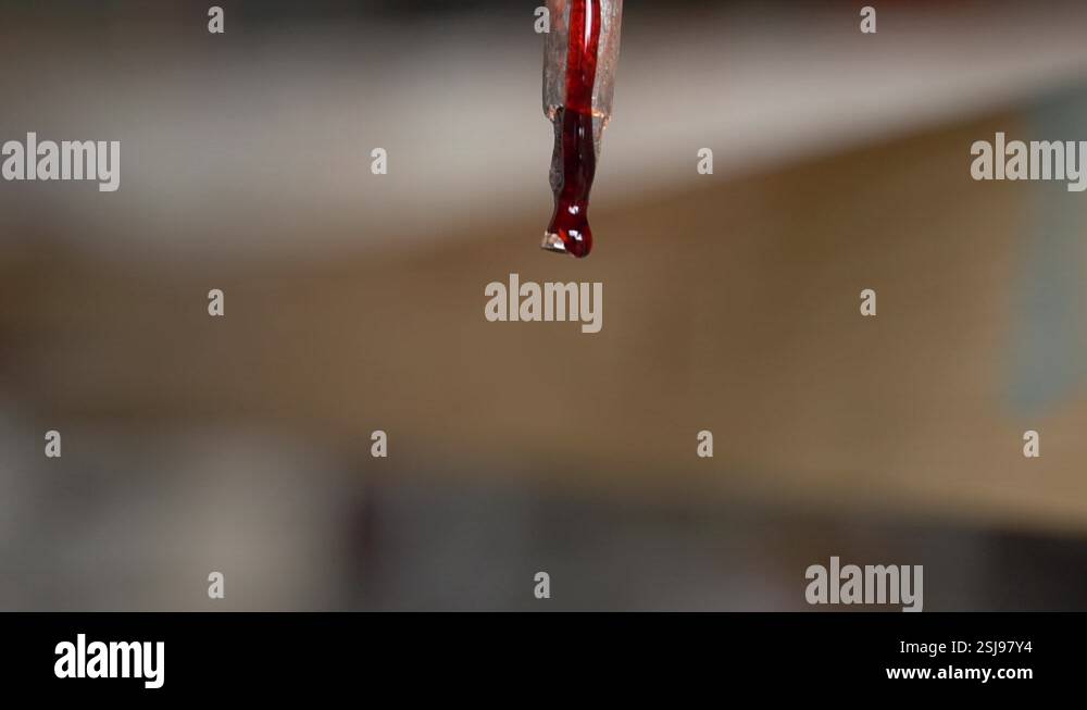 Dark crimson blood dripping from a nail in hammered into a cross Stock ...