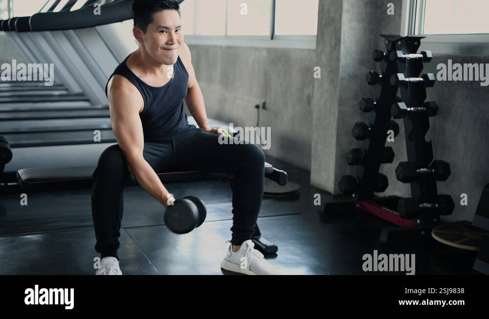 Fitness concept of 4k Resolution. Young asian men lifting dumbbells in ...