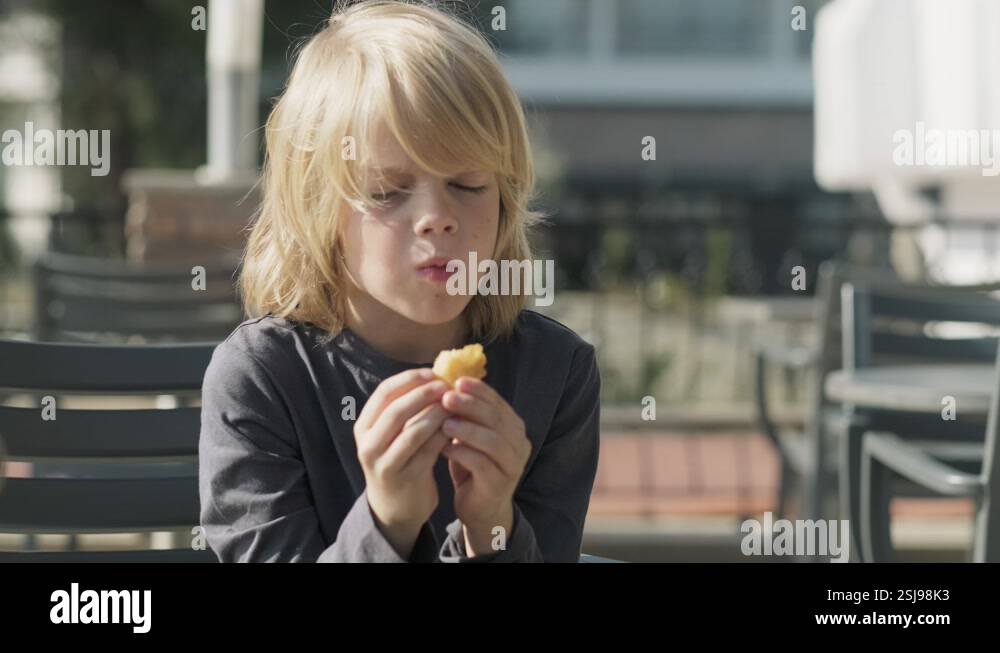boy eating chicken nuggets in fast food McDonalds Restaurant 23.03.20 ...