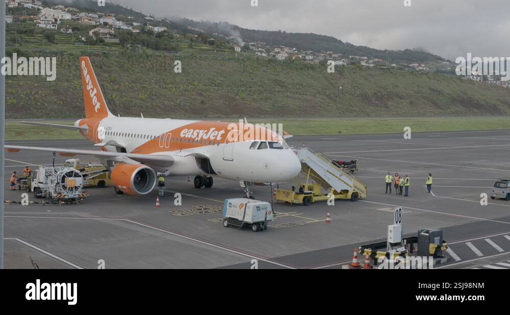 An Easyjet plane being refuelled at Funchal airport, Madeira with ...