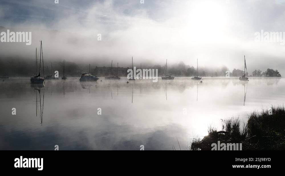 Autumn mist on Lake Windermere, Ambleside, Lake District, UK with ...