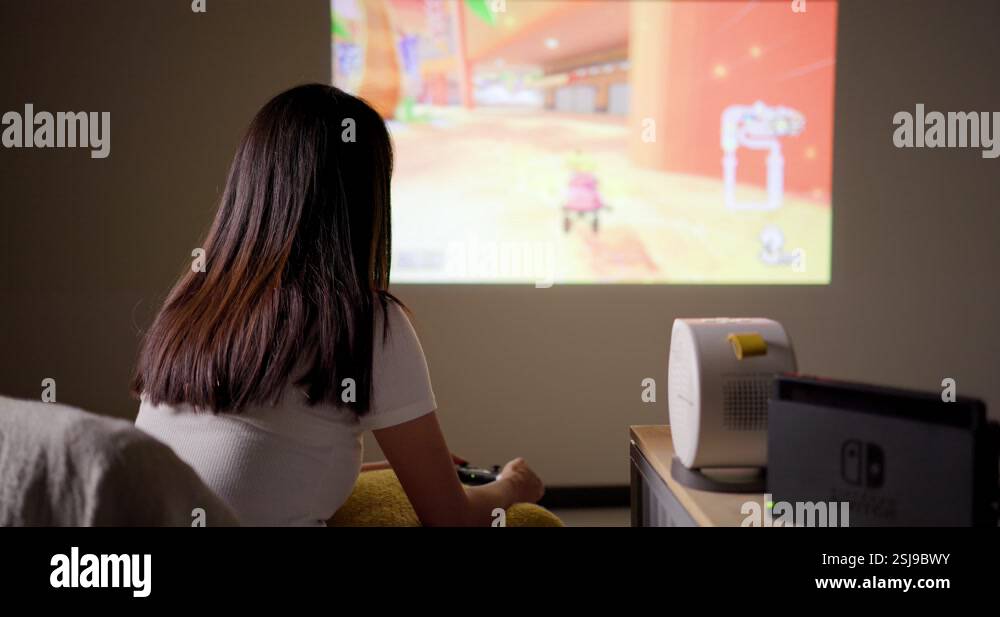 Taiwan 26 November 2022: Woman play mario kart with projector on the ...