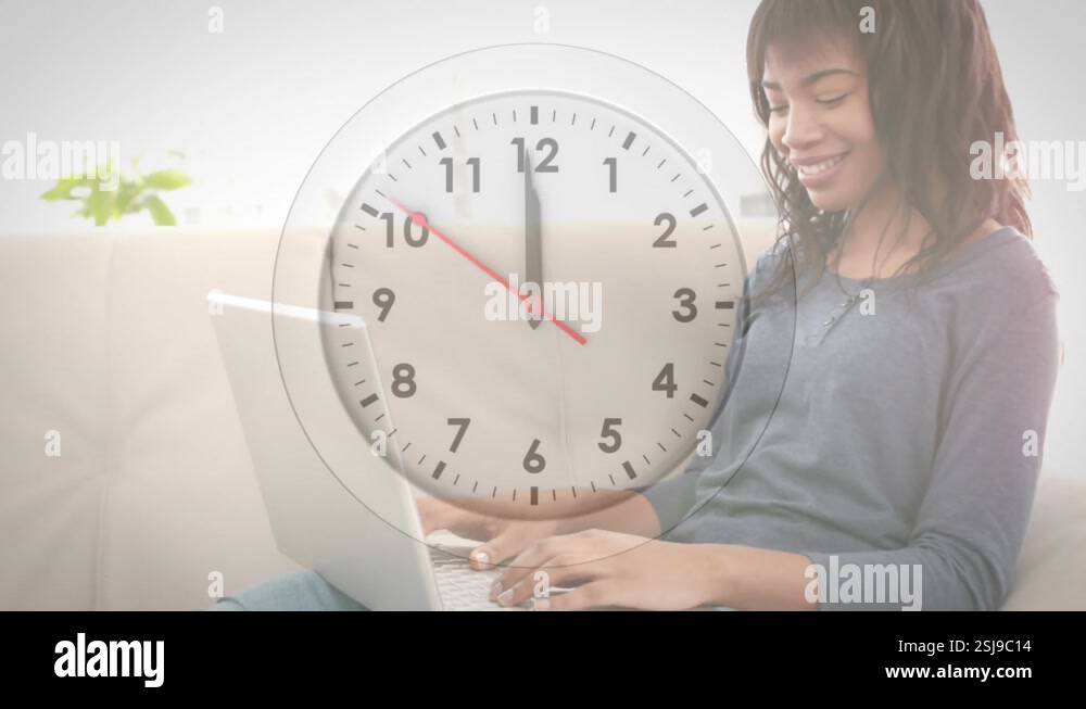 Animation of clock ticking over african american businesswoman in ...