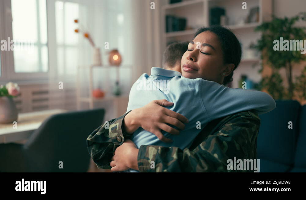Boy hugging his mom leaving for military service, serving in armed ...