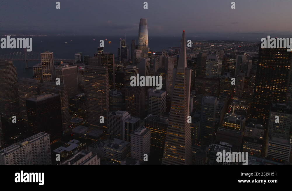 Aerial slide and pan footage of modern high rise downtown buildings at ...