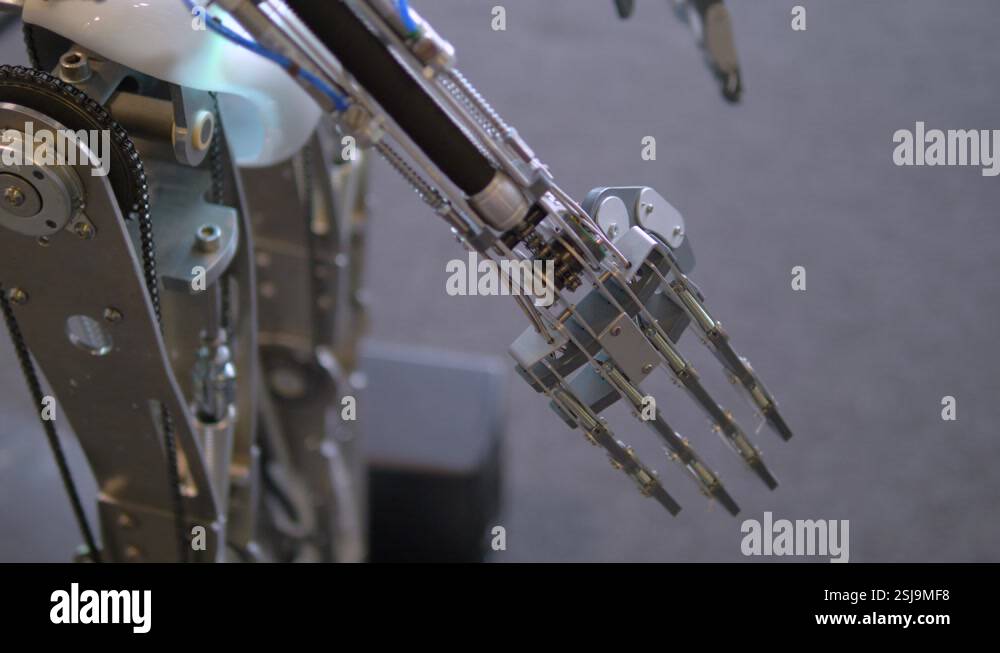 Robotic AI controlled hand moves in jerky motions at conference display ...