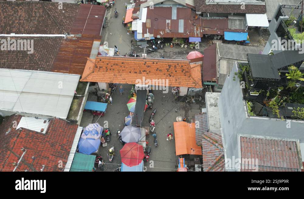 Aerial drone shot over a market in the street in Indonesia Pandaan ...