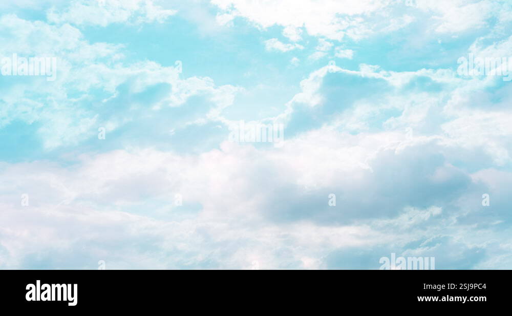 Translucent fluffy clouds rush across relaxing aqua blue sky with sun ...