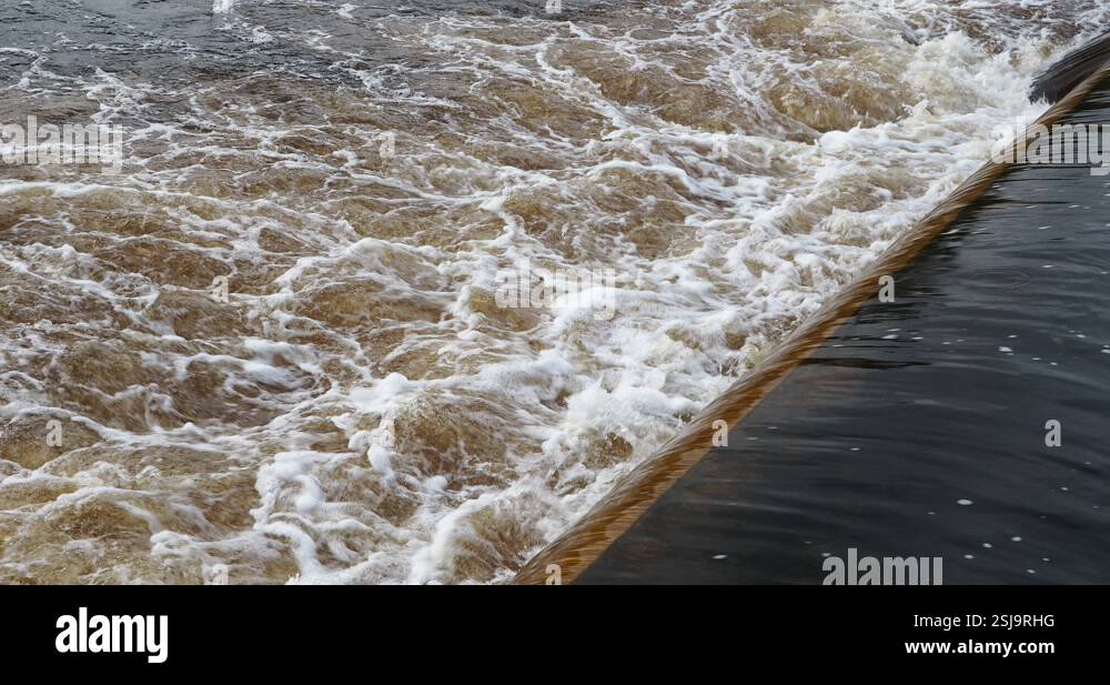 Peat stained water in the River Ribble at Clitheroe, Lancashire, UK ...