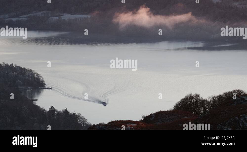 Cloud backlit by the setting sun over Lake Windermere from Wansfell ...