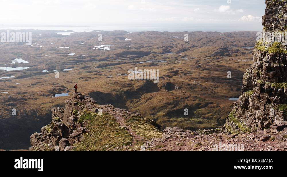 A climber on an exposed ridge on Quinag in Assynt, Scotland, UK Stock ...