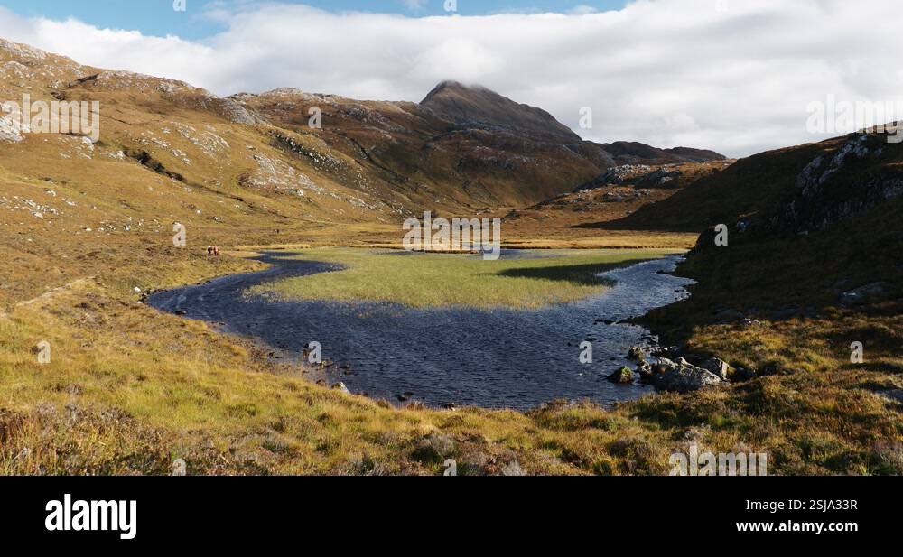 Canisp in Assynt, Scotland, UK with hikers on a path below Stock Video ...