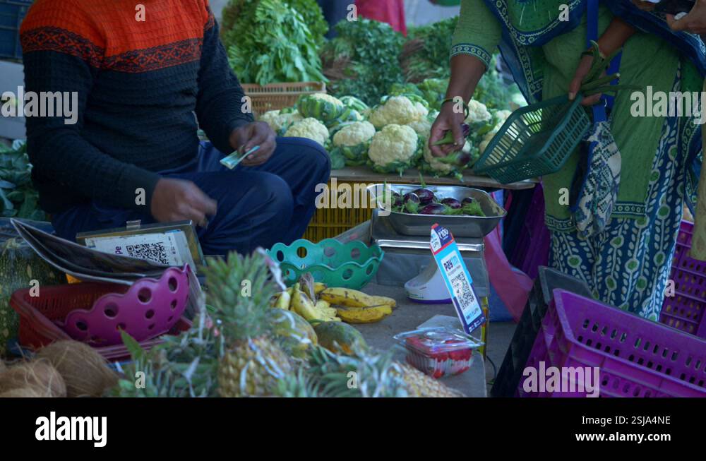 Indian street vegetable seller keeping Paytm UPI QR code scanner for ...