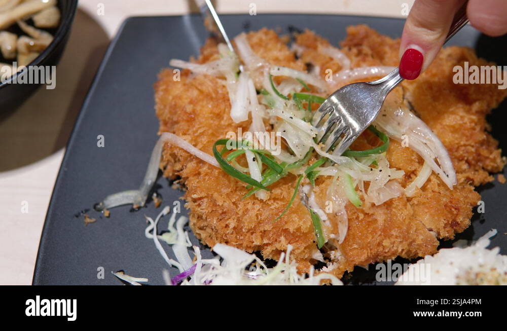 Close-up Cutting Korean Deep Fried Crispy Chicken Tonkatsu Cutlet with ...