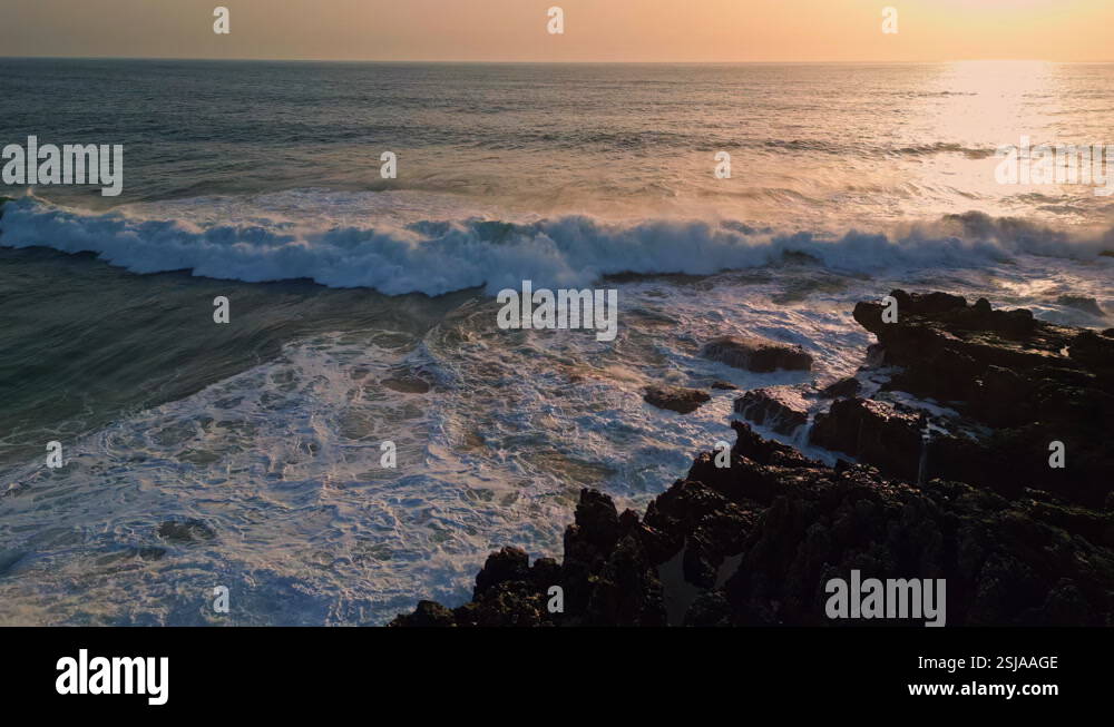 Summer ocean splashing sunrise light drone view. Sun rays reflecting ...