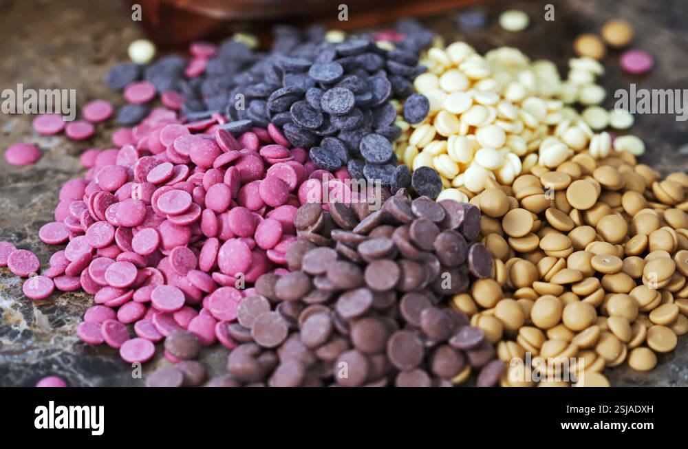 Ruby white and dark chocolate callets closeup - Tempered chocolate ...