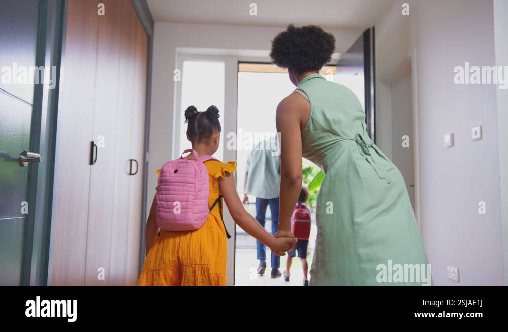 Parents At Home Helping Children Get Ready And Leave As Family Go To ...