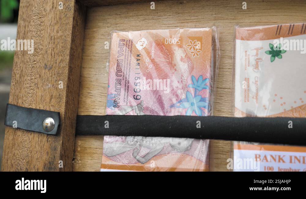 Indonesian money Rupiah exchange, banknotes on display Stock Video ...