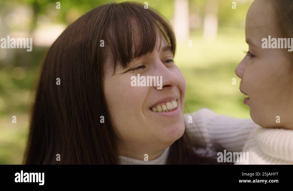 child hugging mother. mom child park walk. happy family. woman mother portrait Stock Video ...