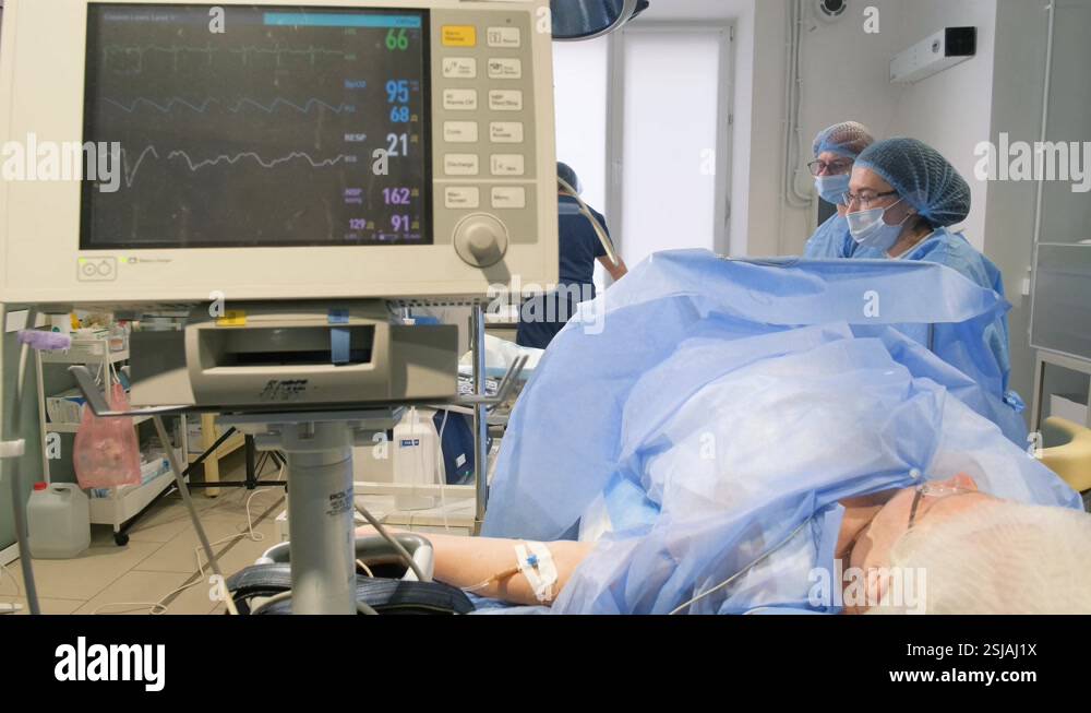 During the operation, the patient lies on the operating table Stock ...