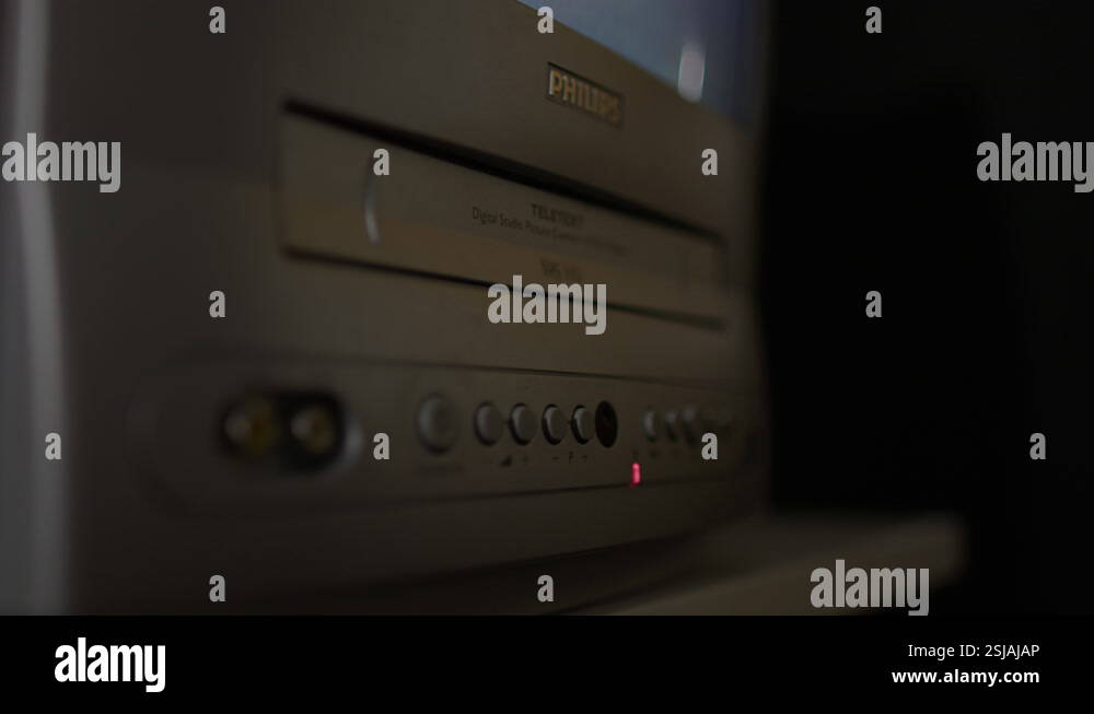 VHS Tape being ejected from TV Stock Video Footage - Alamy