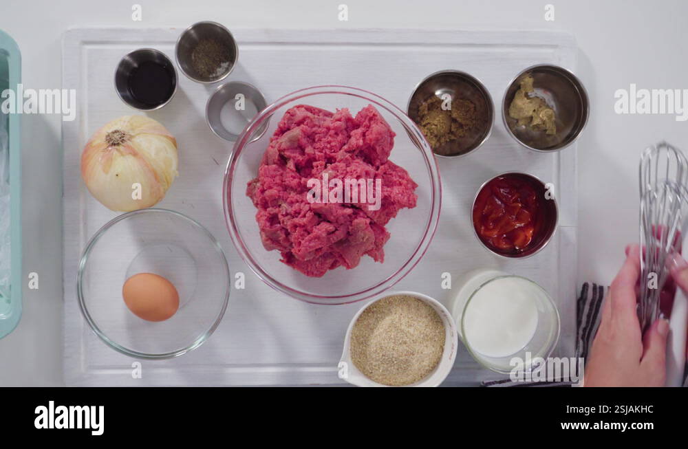 Flat lay. Ingredients for preparing a classic beef meatloaf recipe ...