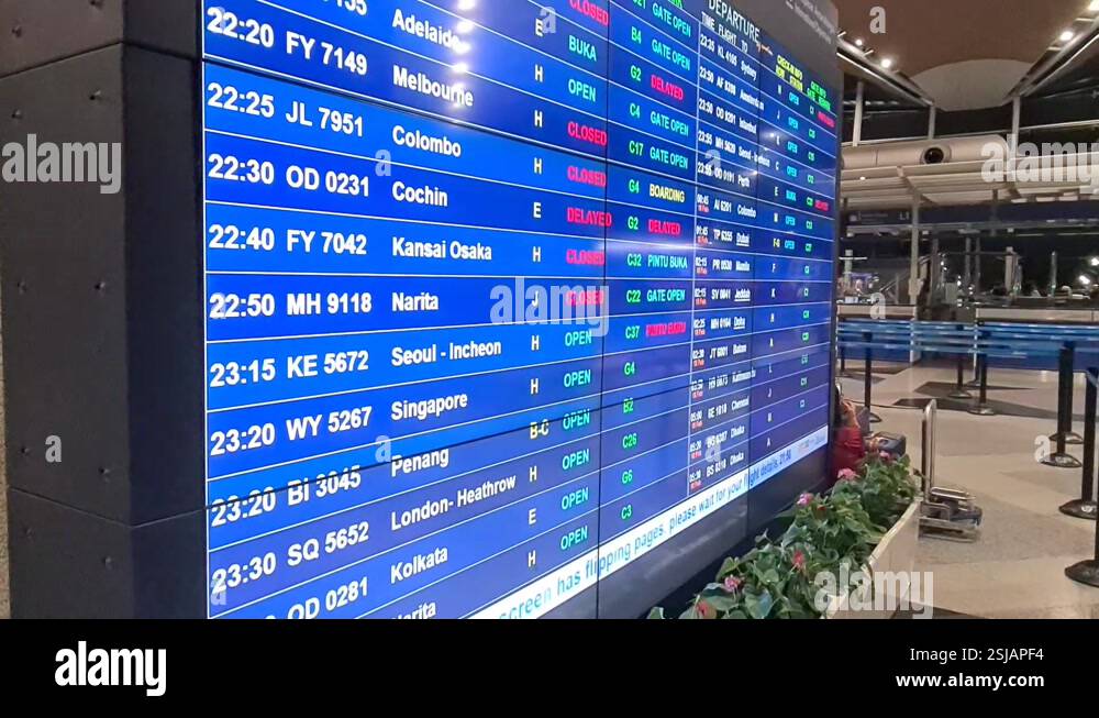 Modern flight schedule screen showing arrival and departure time Stock ...