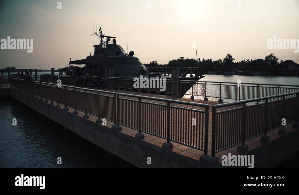 A small docked warship at the Maeklong River Stock Video Footage - Alamy