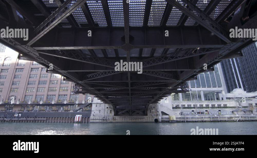 Cars driving over famous bridge in Chicago, yellow Watertaxi rides ...