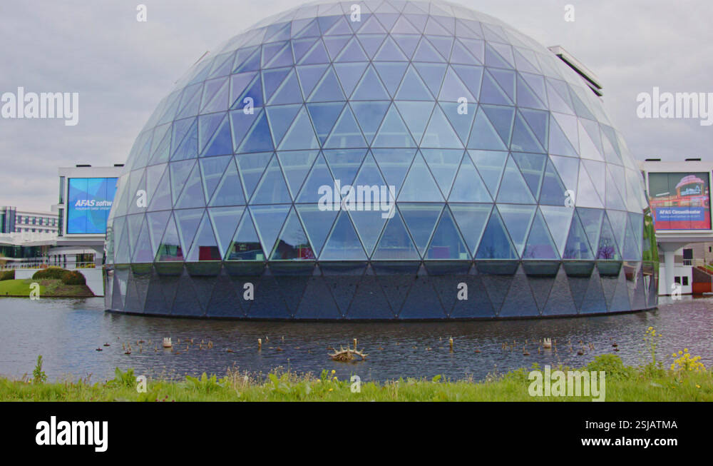 Tilt up of the beautiful AFAS theater building. An unique glass orb ...