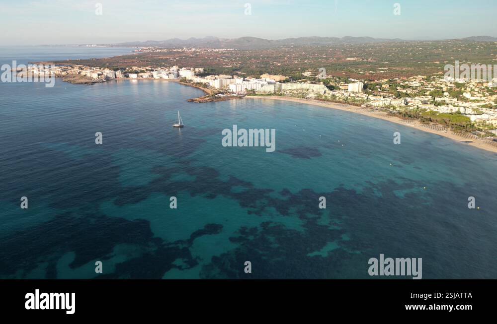 Sailboat Floating On Clear Blue Sea Off The Coast Of Sa Coma In ...