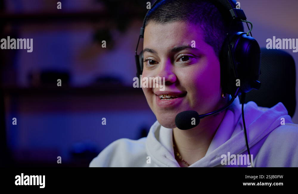 Young gamer discusses strategy of joint game with teammate Stock Video ...