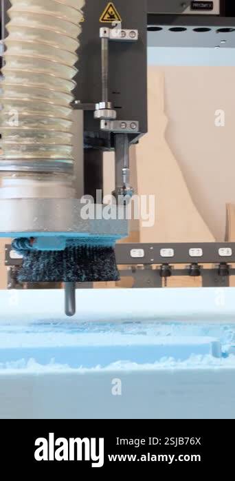 A CNC router performing rough milling of a sculpture in an extruded ...